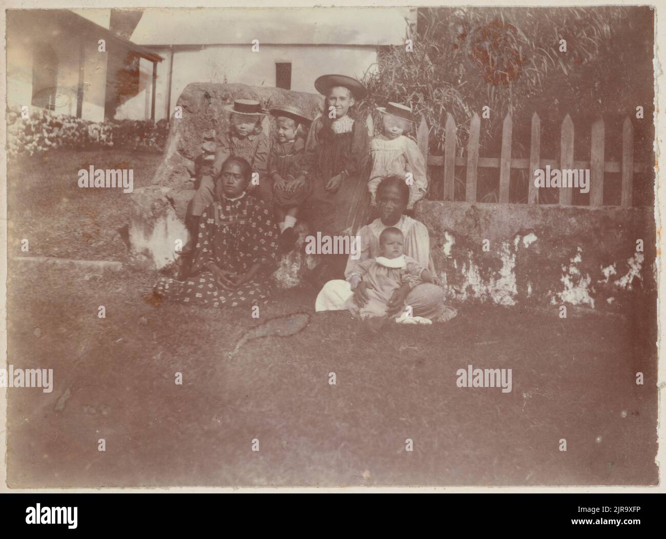 Portrait of European children and two Cook Islander women. From the ...