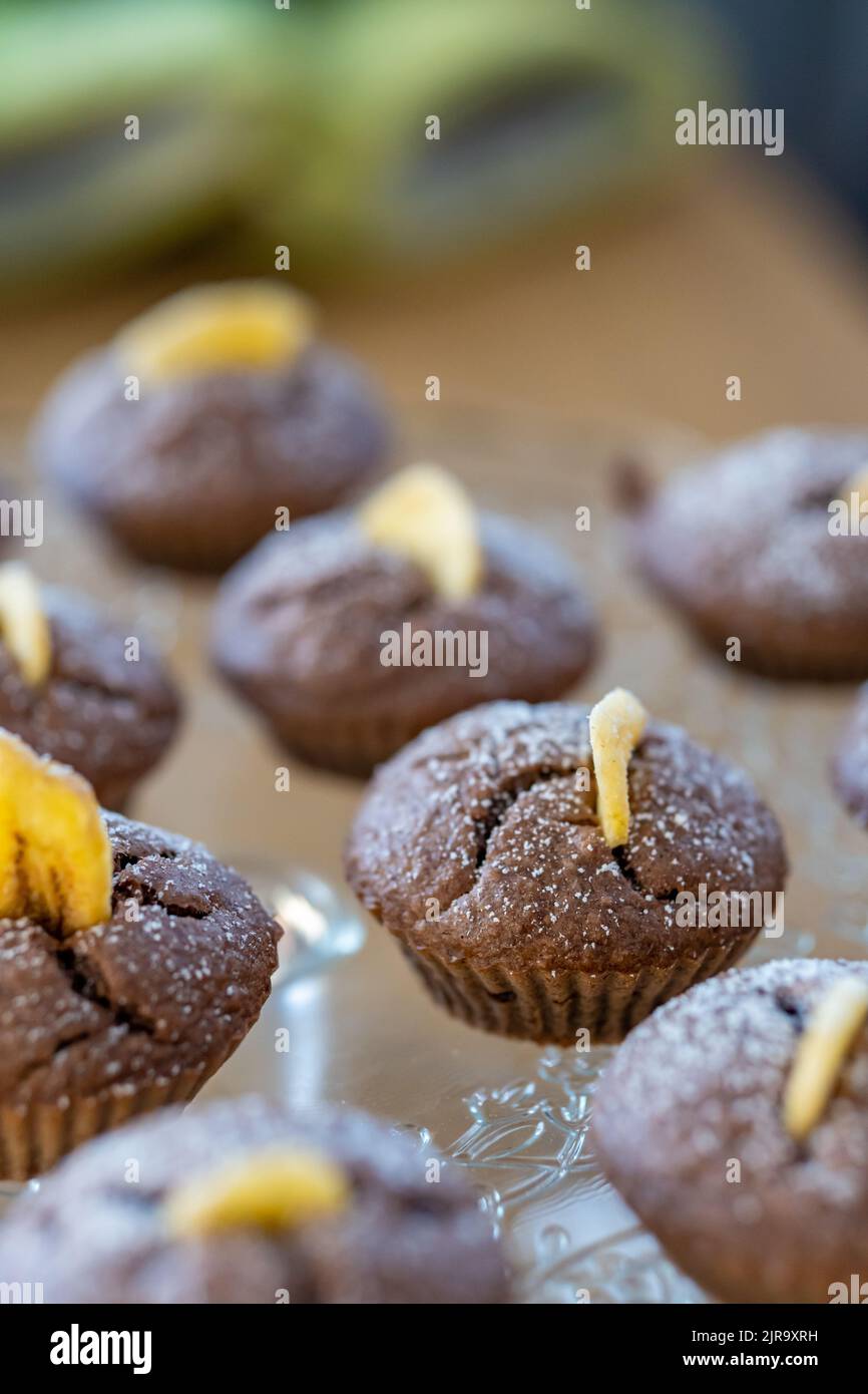 A vertical shot of a delicious, chocolate cupcake with fruits Stock ...