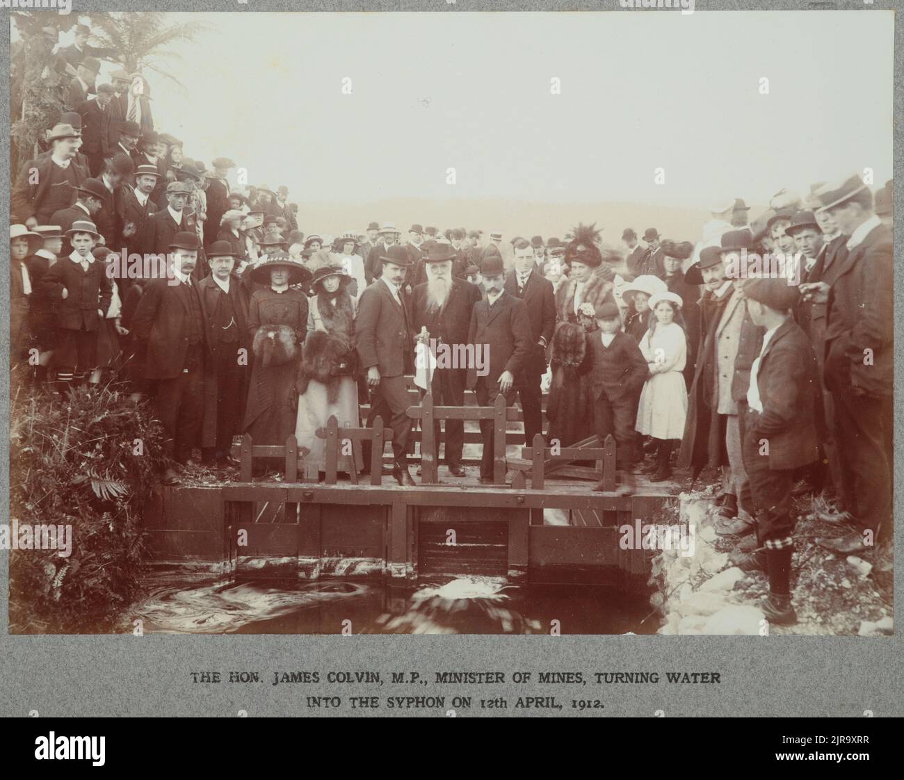 The Hon. James Colvin, MP, Minister of Mines, turning water into the ...