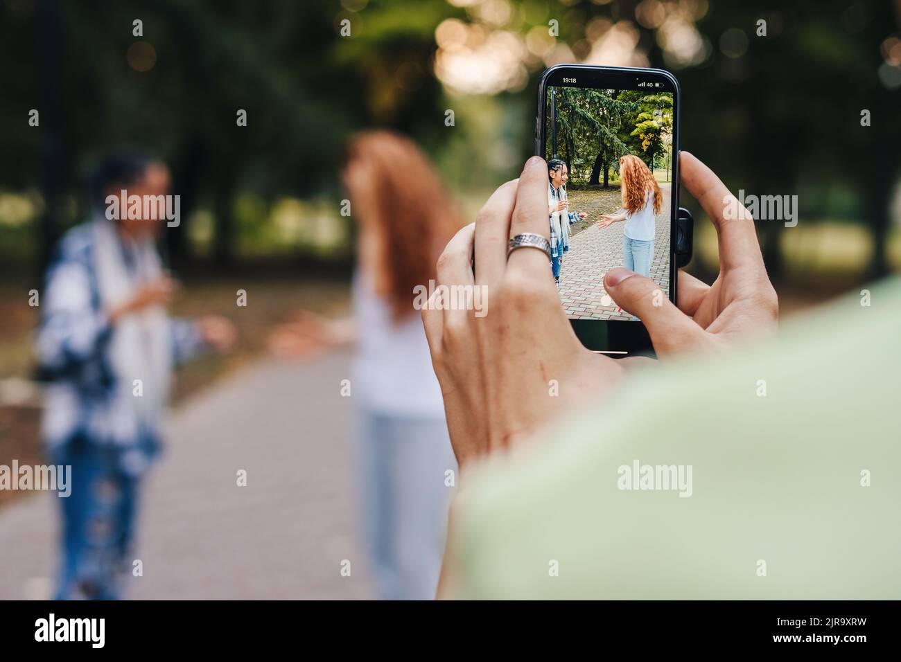 Social media user boy recording a video with his friends to flaunt her ...