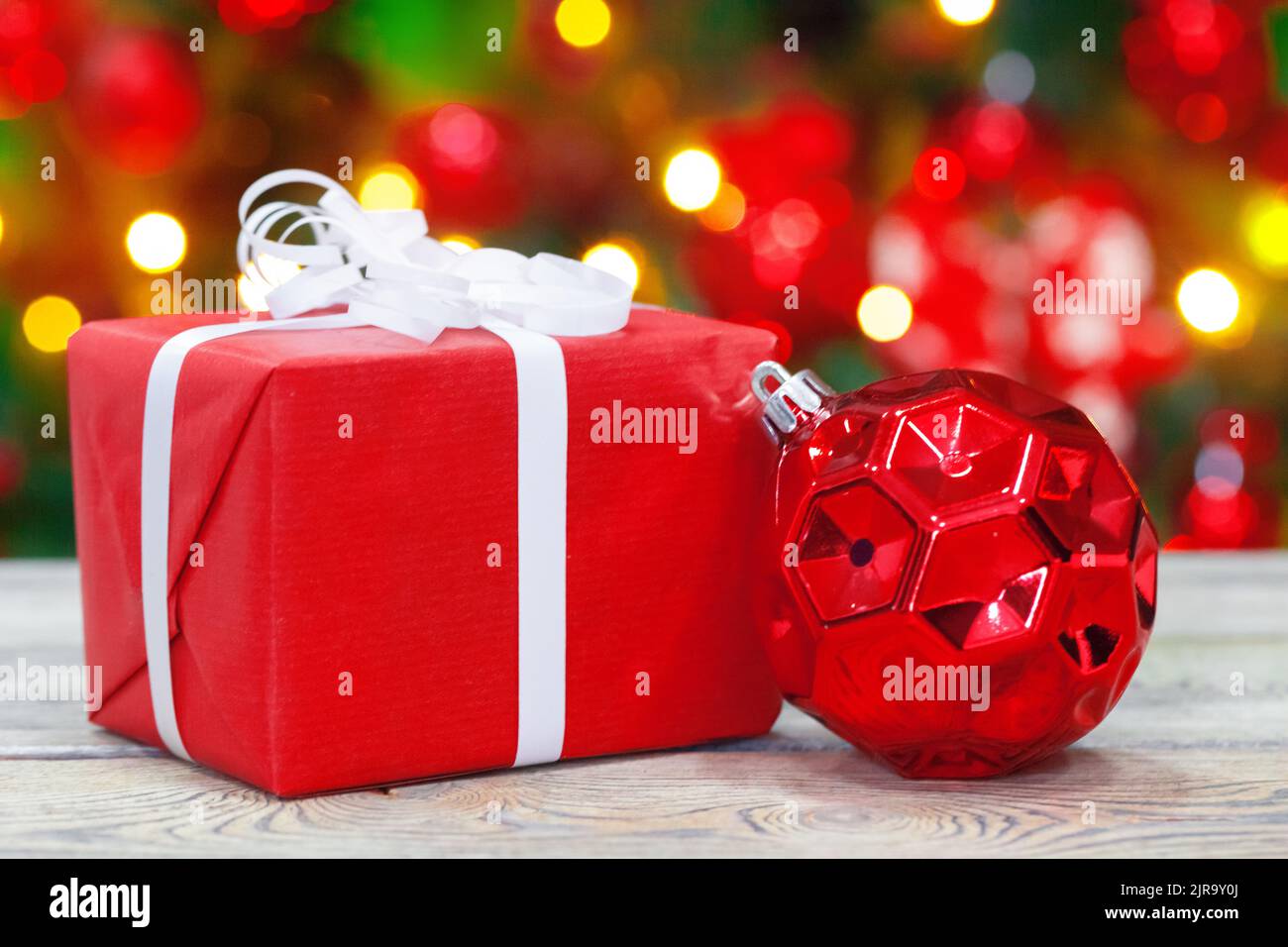 present for christmas on wood table Stock Photo - Alamy