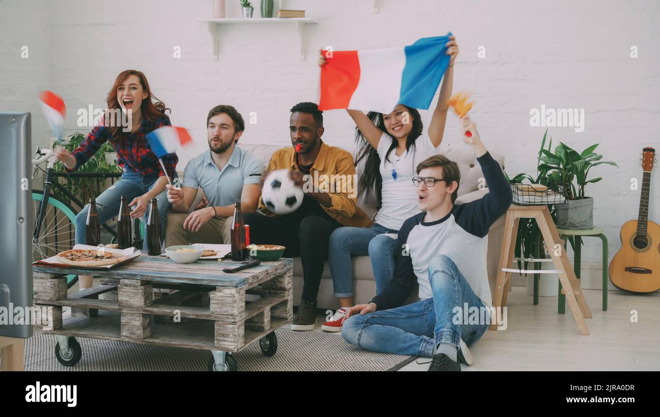 Multi-ethnic group of friends sports fans with French flags watching ...