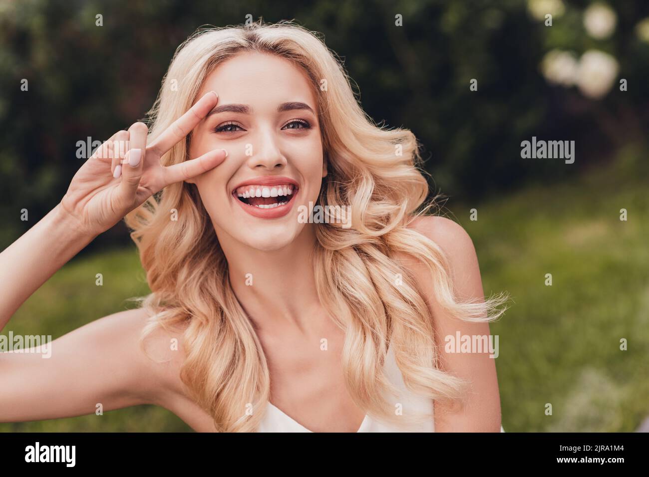 Photo of adorable funky young curly girl dressed white singlet showing ...