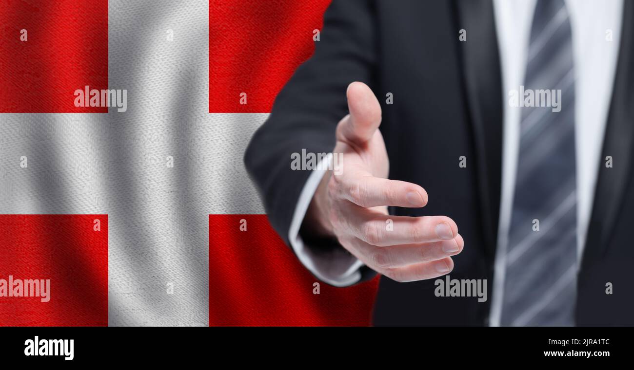 Welcome to the Denmark. Hand on Danish flag background. Business ...