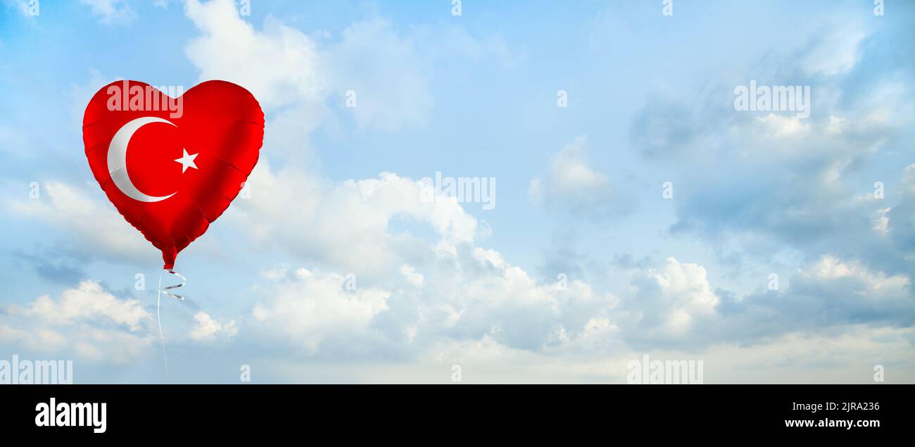 Turkish flag on balloon against sky clouds background. Education ...