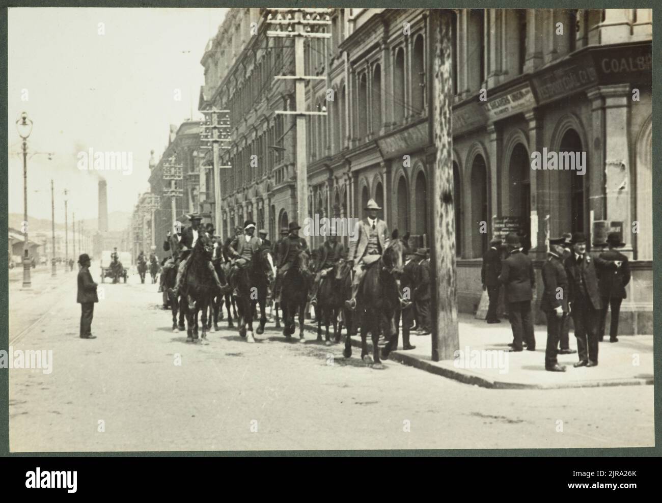 [group of men on horseback on city street]. From the album: Wellington ...