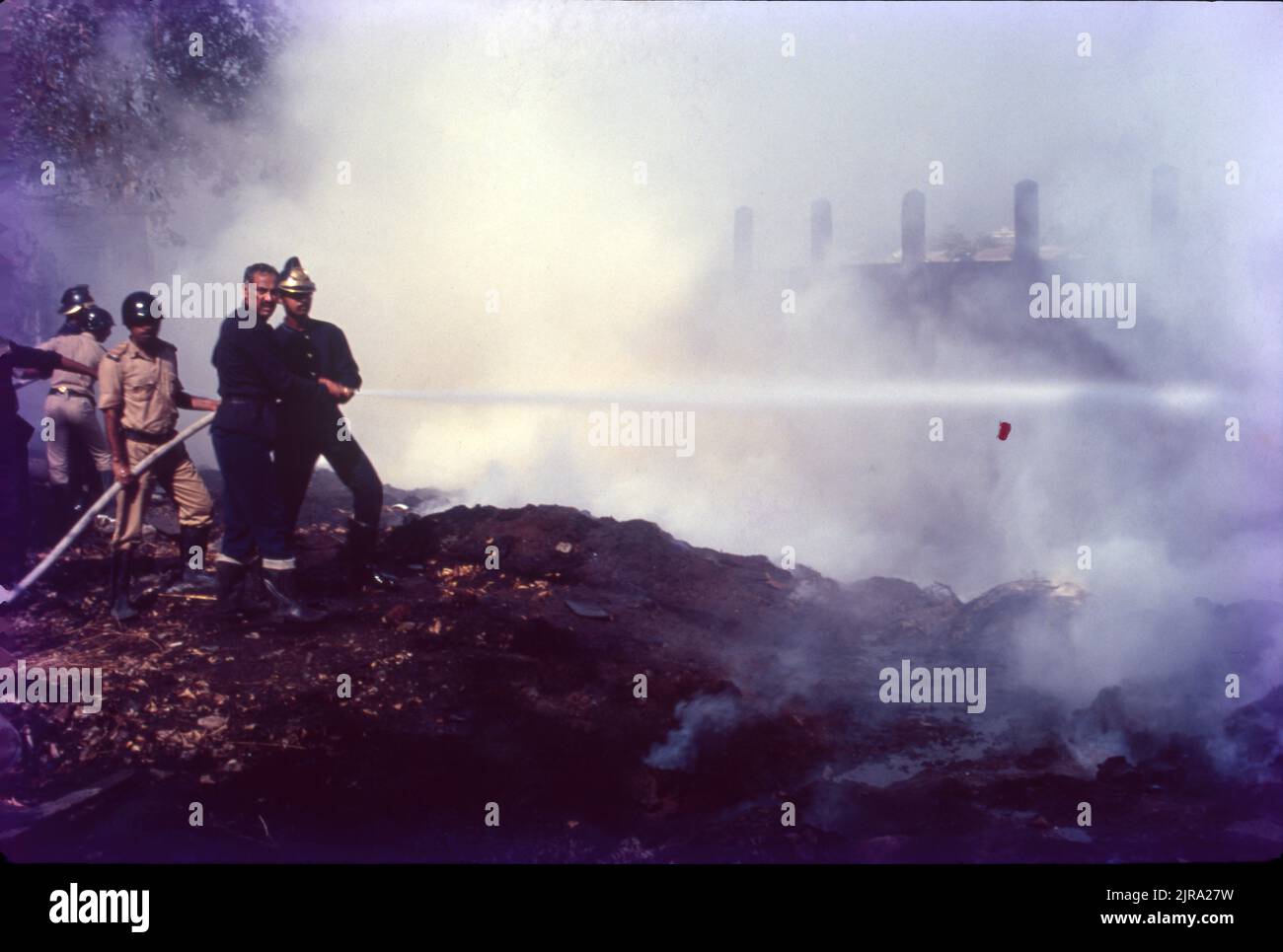 Fire fighters dousing fire, Kurla, Mumbai Stock Photo - Alamy