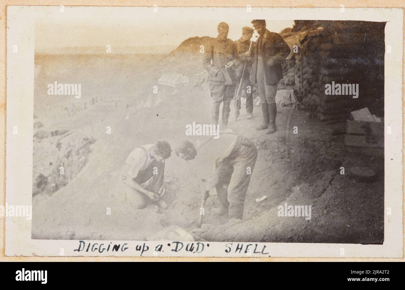 Digging up a 'dud' shell. From the album: Photograph album of Major J.M ...