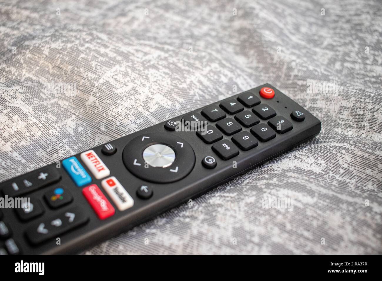 A black remote controller of a TV Stock Photo - Alamy