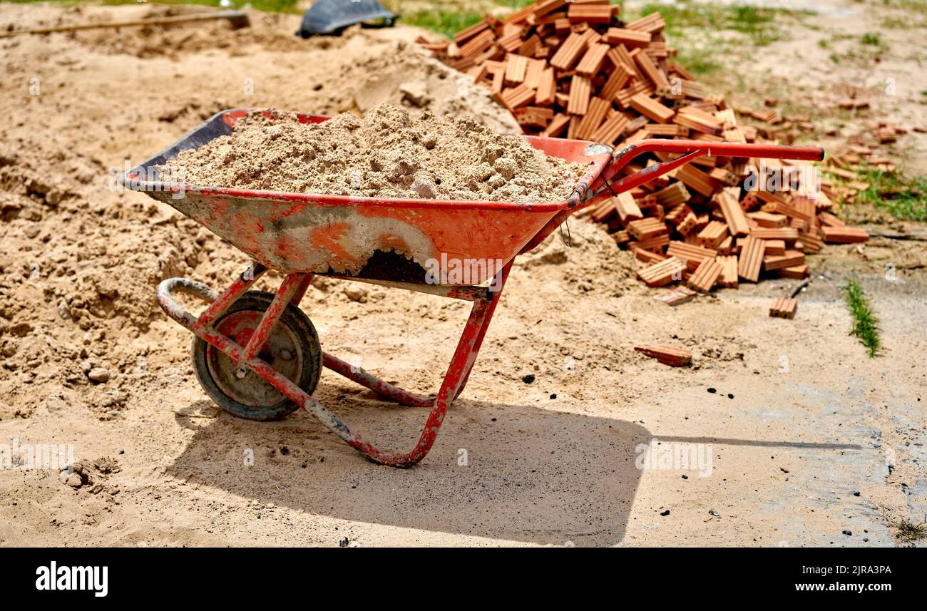 An old funny wheel barrow with only one handle, at a Thai temple Stock ...
