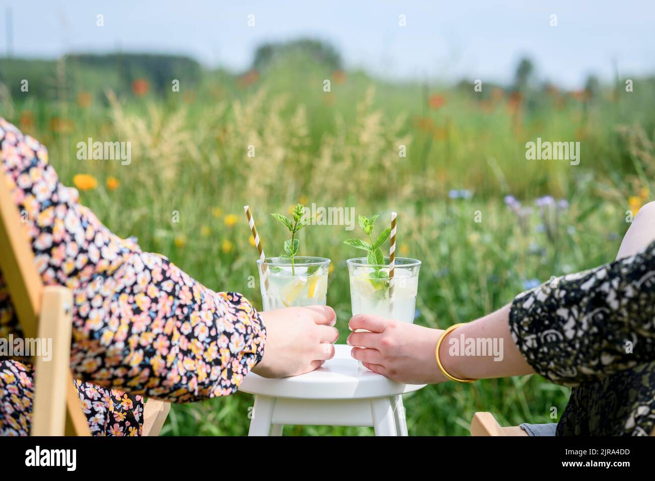 Woman sipping drink in hi-res stock photography and images - Alamy
