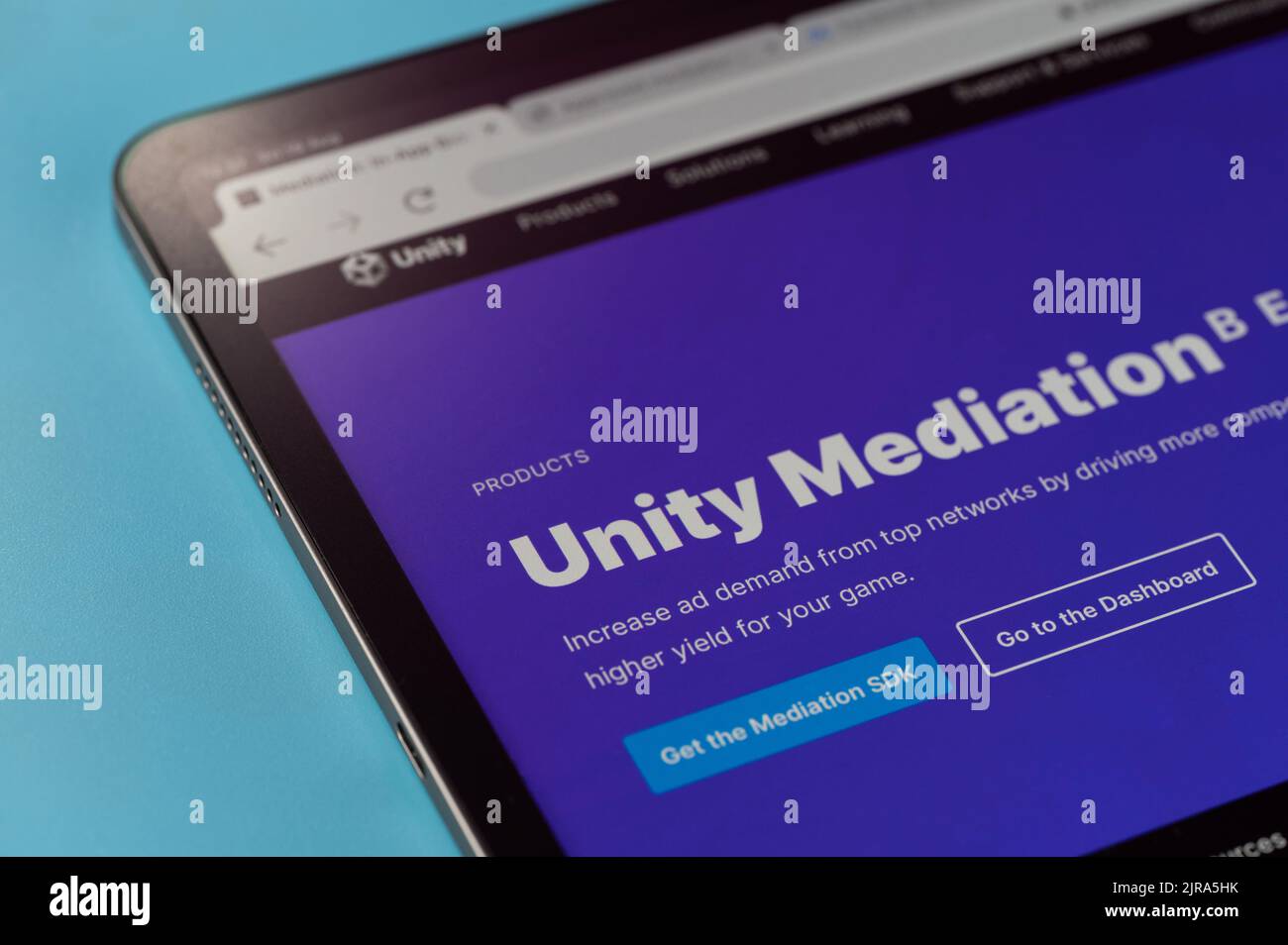 New york, USA - august 20, 2022: Browsing Unity Mediation ads service on tablet screen macro ...