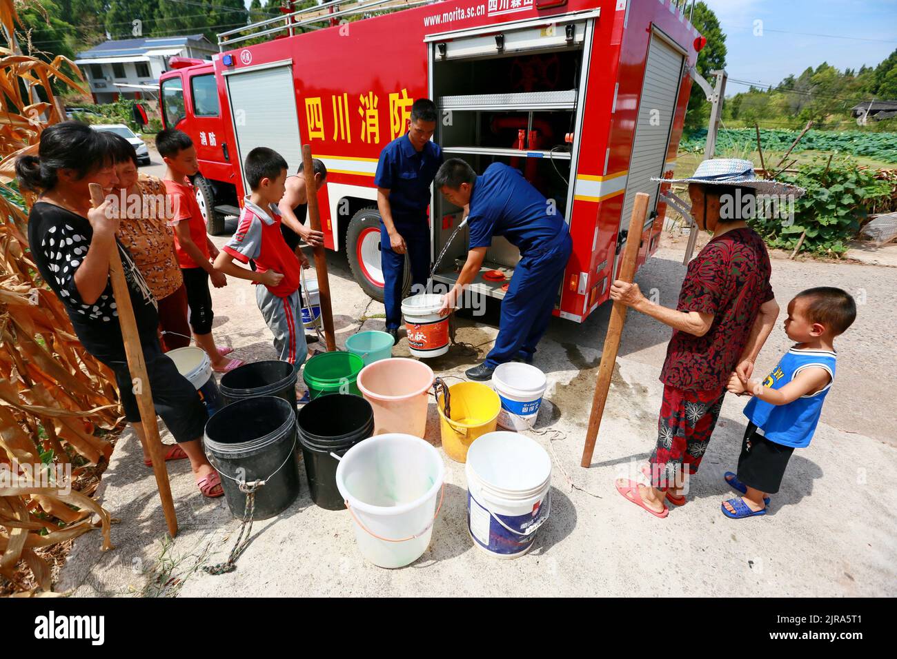 SUINING, CHINA - AUGUST 23, 2022 - Villagers carry water home in ...