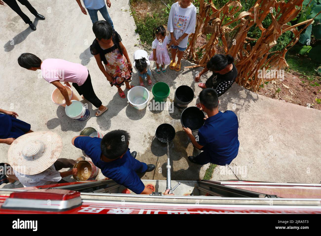 SUINING, CHINA - AUGUST 23, 2022 - Villagers carry water home in ...
