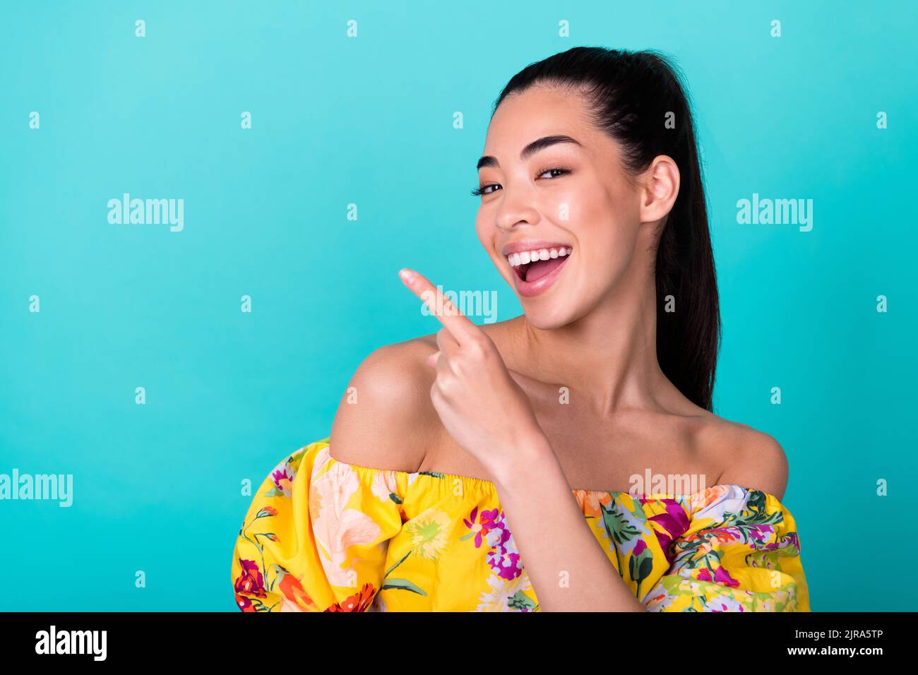 Photo of funny young brunette lady show empty space wear yellow blouse ...