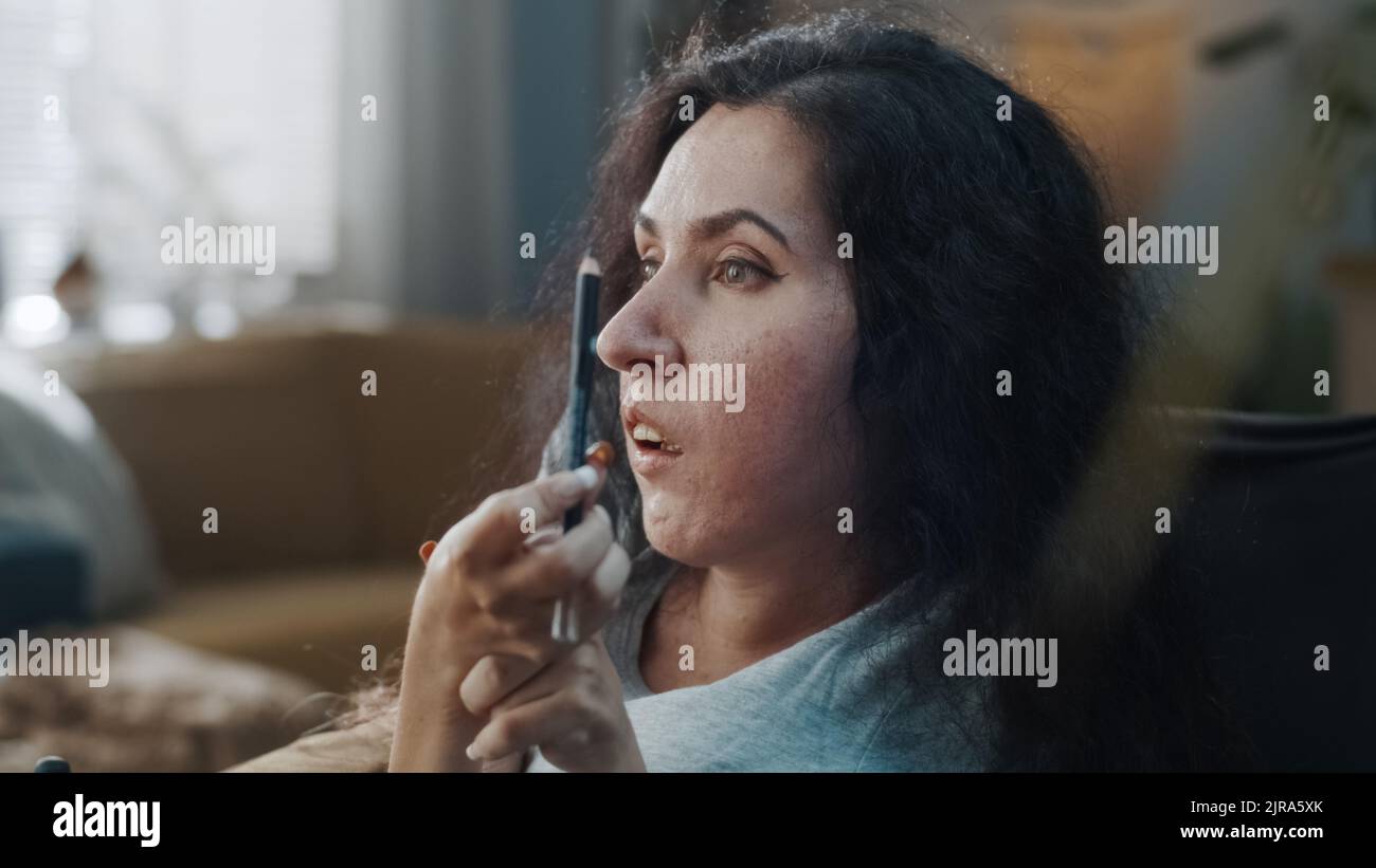 Beautiful pretty woman with a disability doing an evening makeup using ...