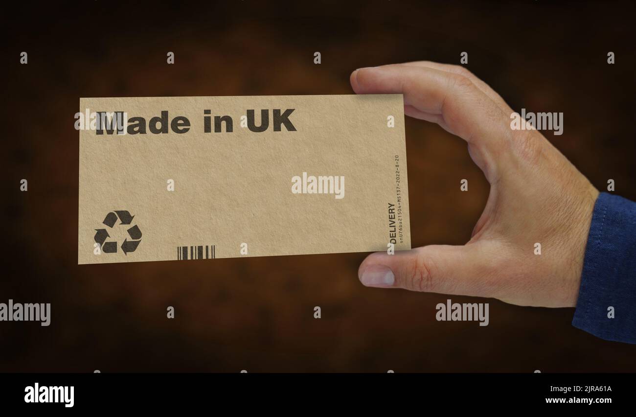 Made in UK box in hand. Manufacturing and delivery. Product factory ...