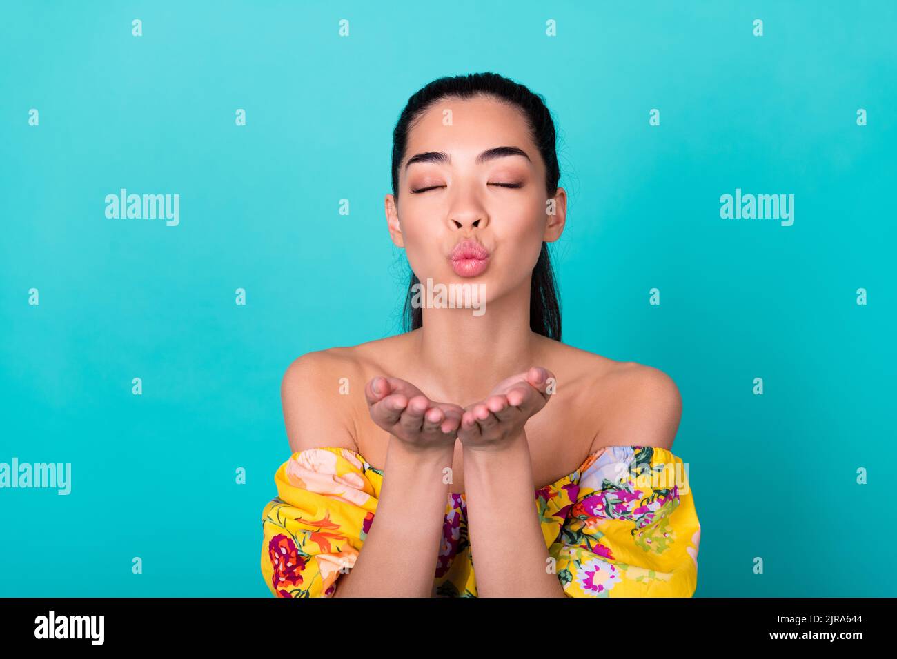 Photo of romantic young brunette lady blow kiss wear yellow blouse ...
