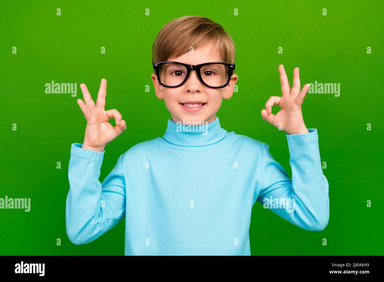 Photo of positive pretty small son wear turquoise turtleneck spectacles ...