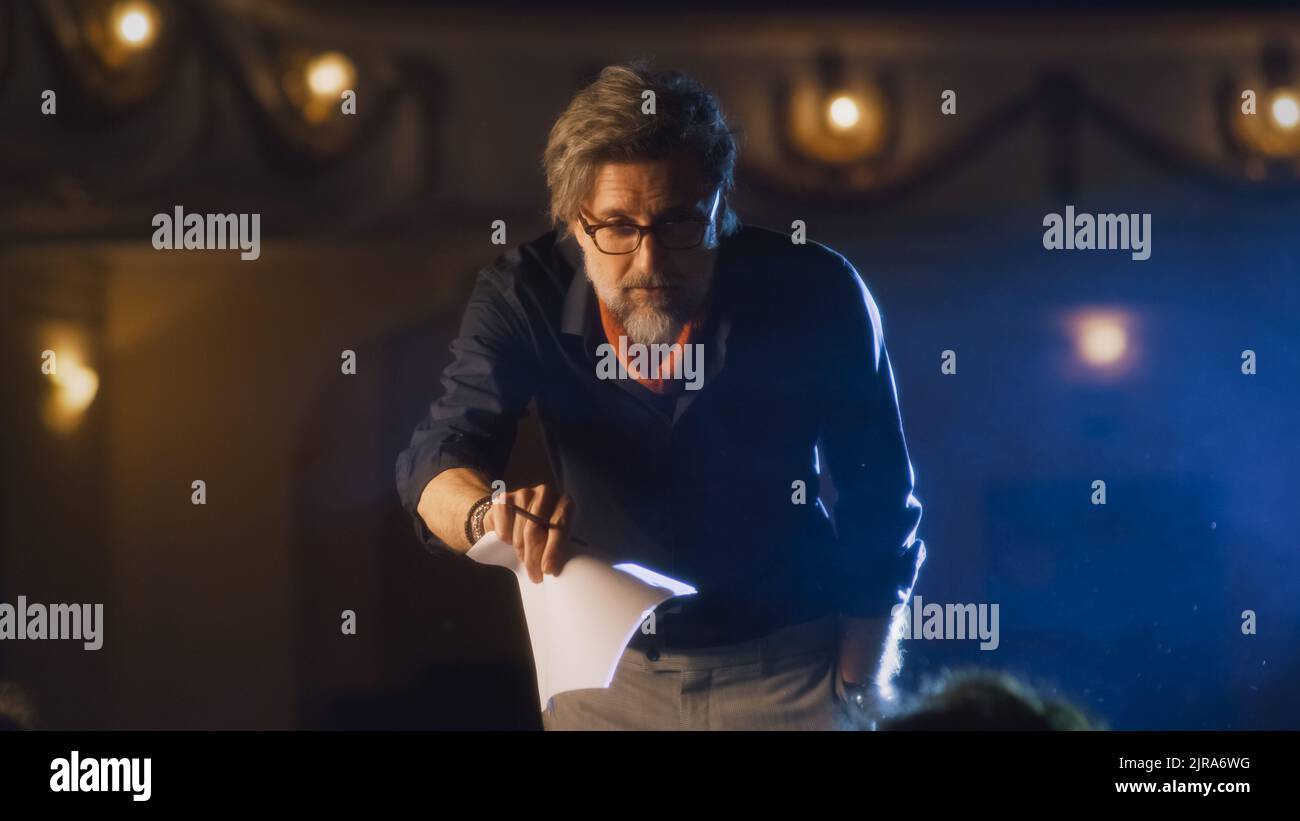 The actors listening to the instructions of a serious director in ...