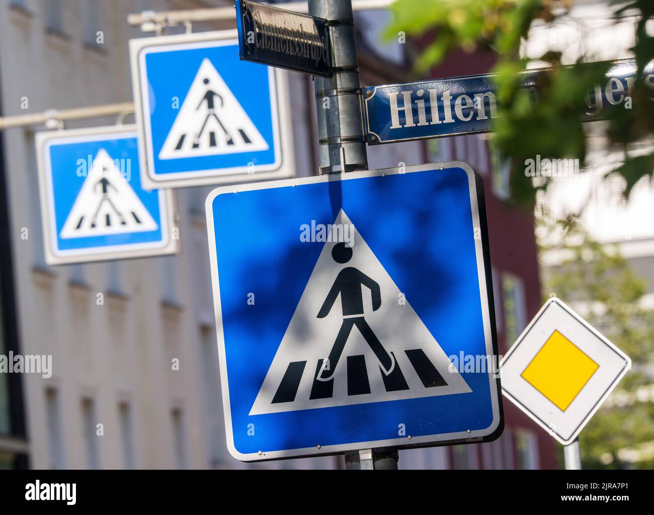 Munich, Germany. 23rd Aug, 2022. Three signs signal the crossing for ...
