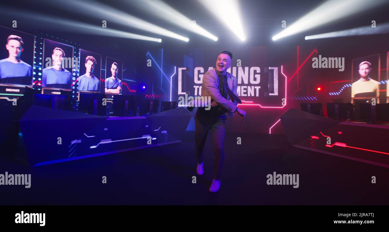 Excited adult announcer speaking to camera at start of professional ...