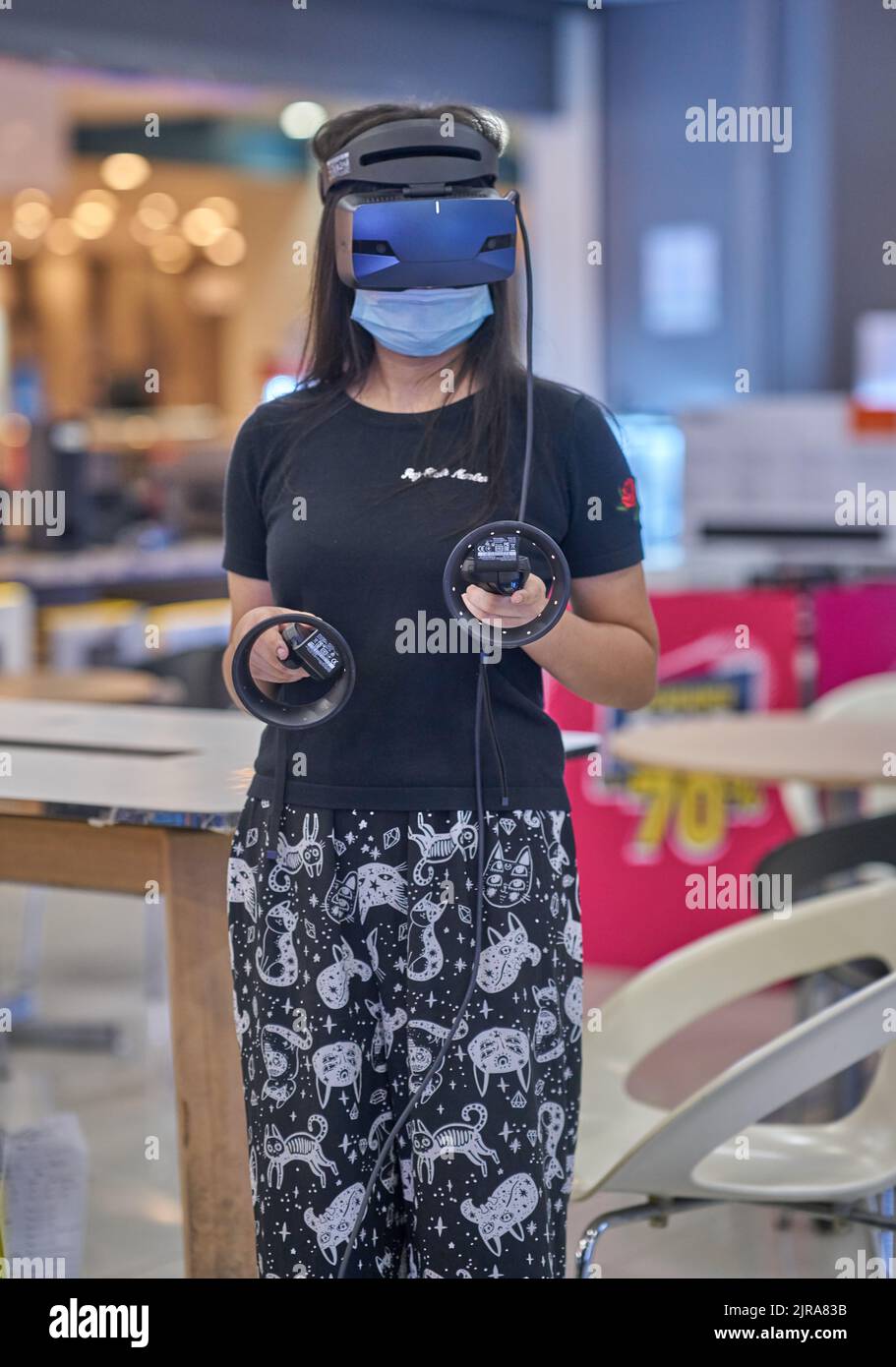 Playing virtual reality games using vr headset Stock Photo - Alamy