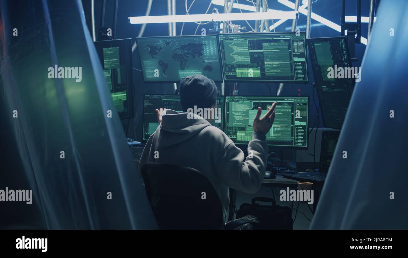 Happy young man in hoodie with glasses and hat dancing in excitement ...