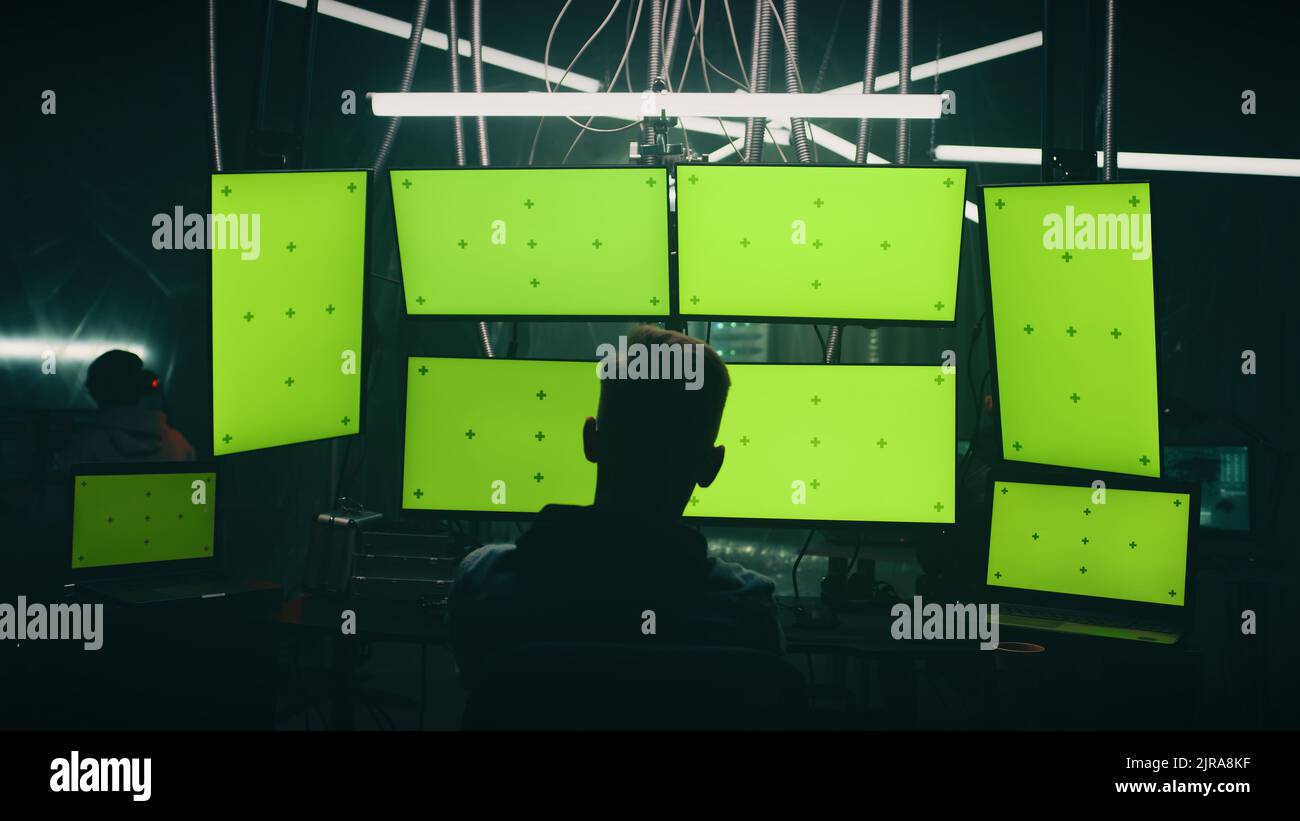 Zoom in view unrecognizable man writing malicious code on computers ...