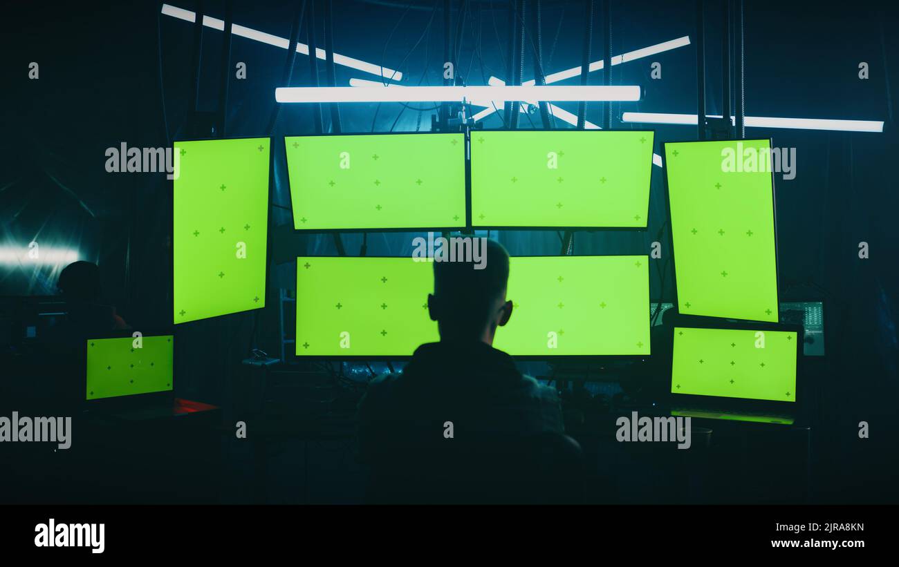 Zoom in view unrecognizable man writing malicious code on computers ...