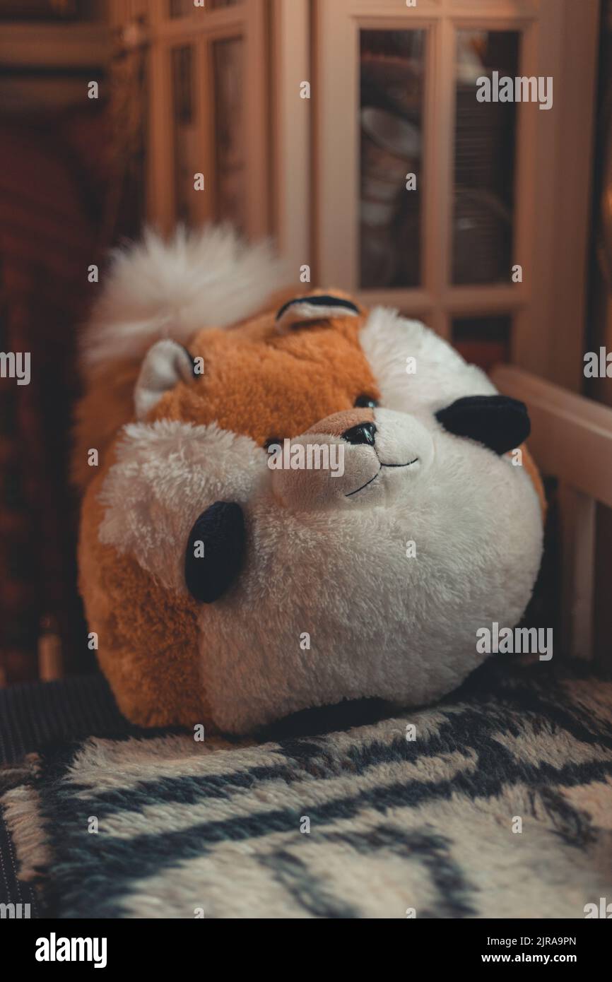 A vertical closeup of a round stuffed toy fox Stock Photo - Alamy