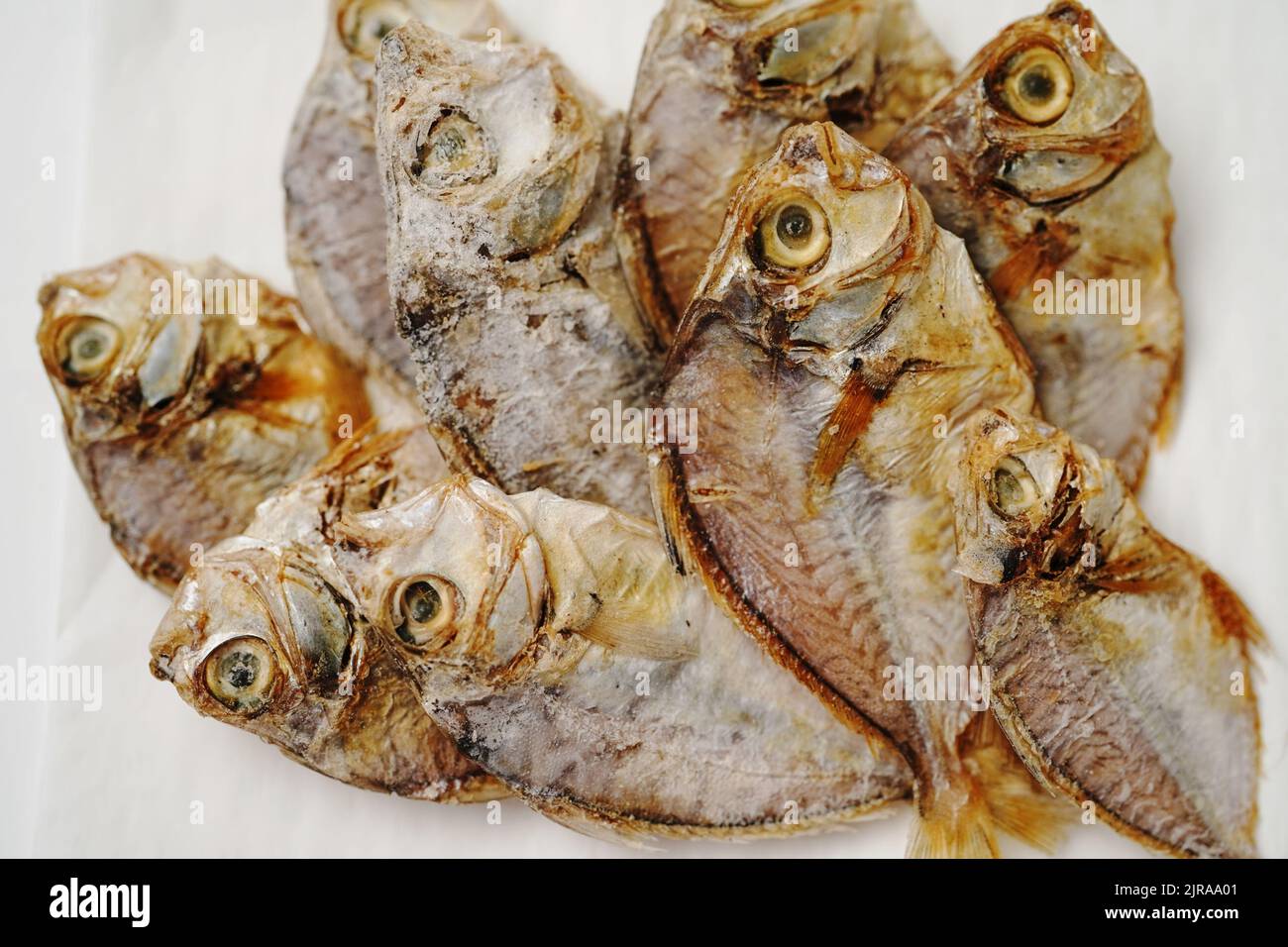 Salted dry fish cod isolated on white background Stock Photo - Alamy
