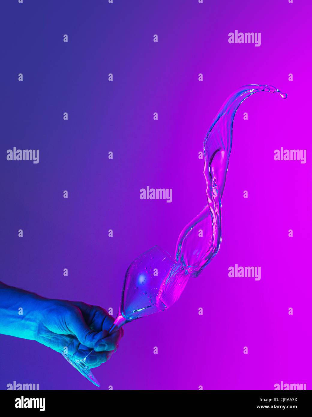 Greeting toast. Authentic hand pouring pure liquid from wine or ...