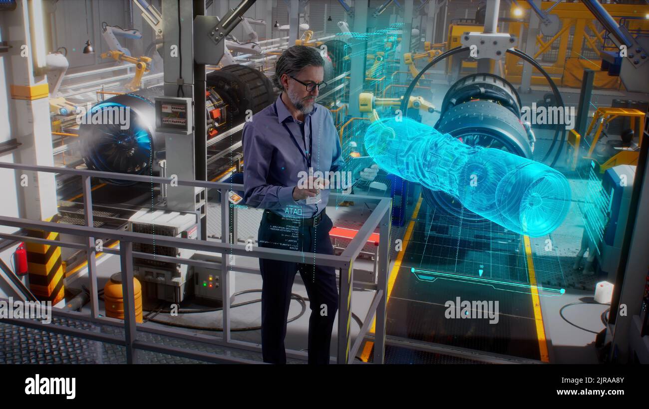 An engineer uses a tablet with a holographic innovative application, to ...