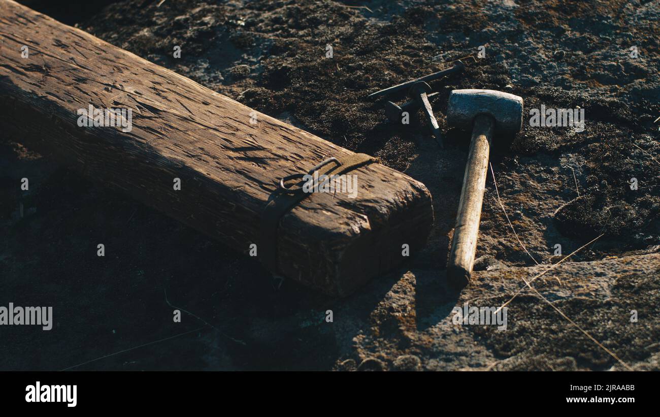 High angle of lumber cross for Jesus Christ execution placed on ground ...