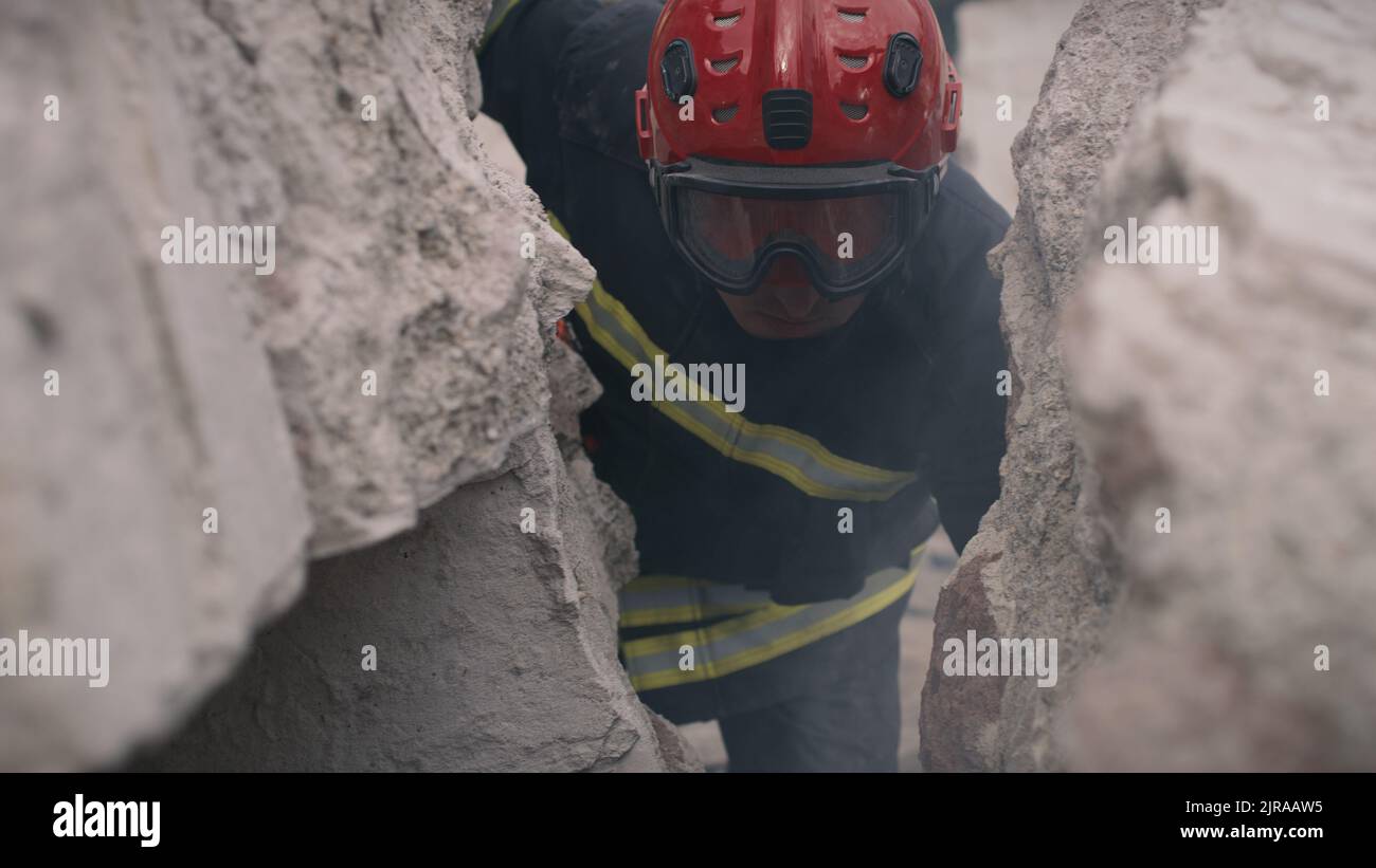 From above aged man suffering from pain and talking with rescuer while ...