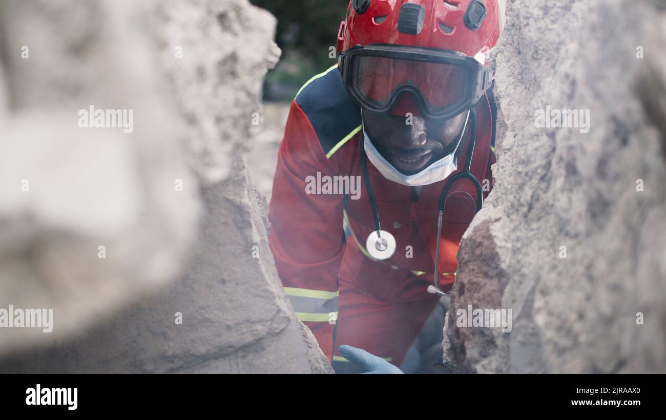 Tilt down view of African American paramedic talking with man suck ...