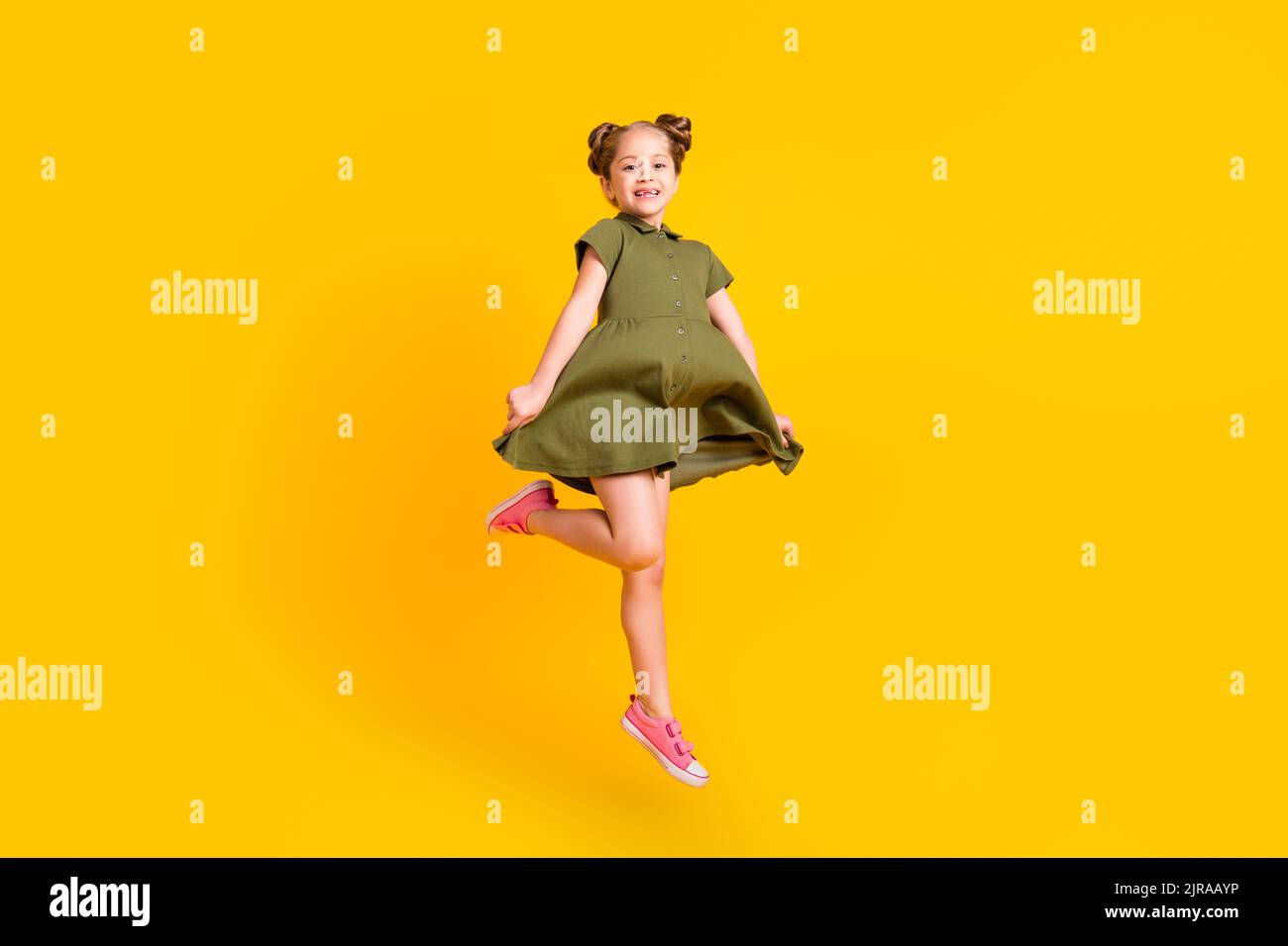Full size portrait of active energetic person jumping have fun hold ...