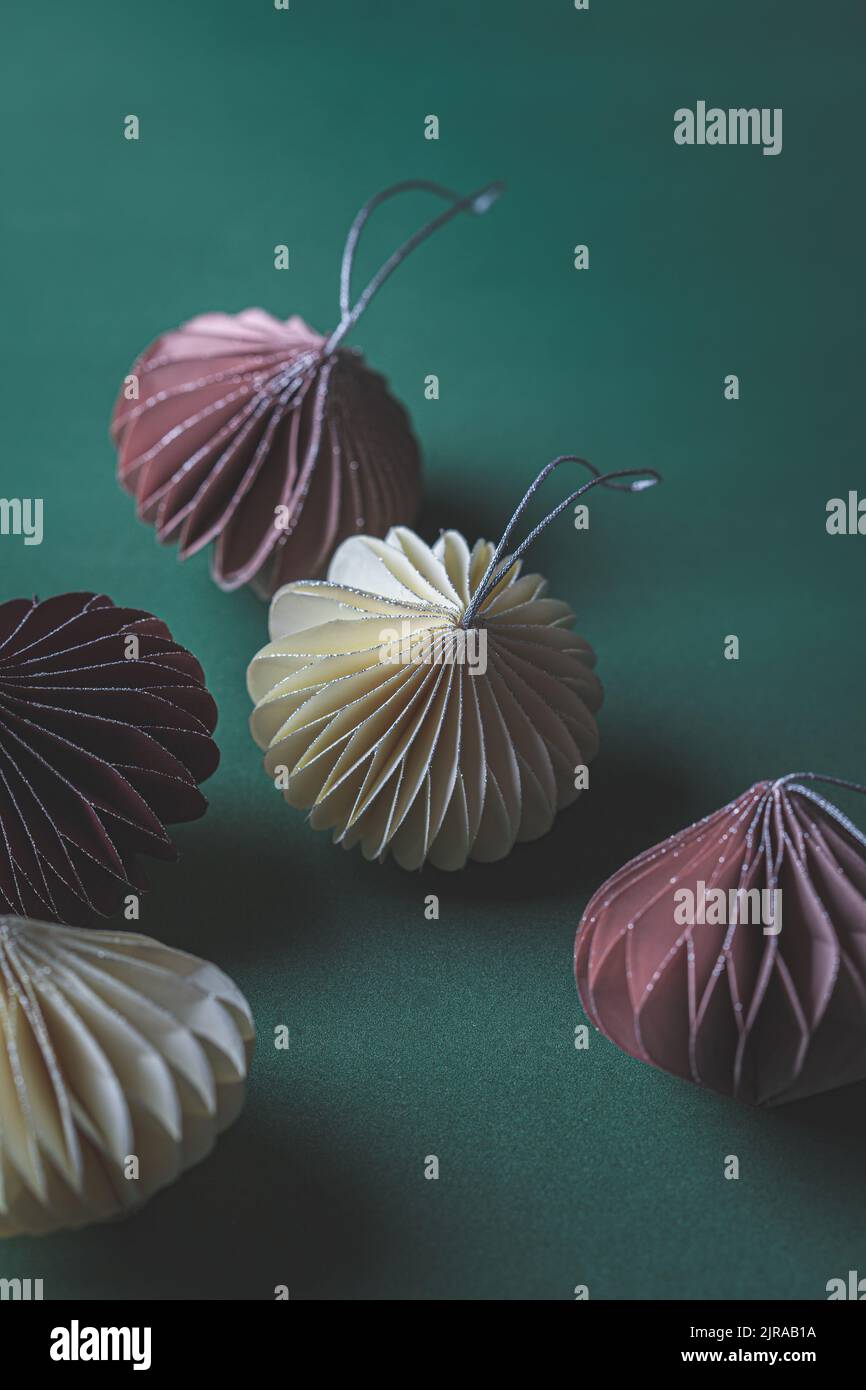 Paper handmade Christmas tree balls of different colors close-up on ...