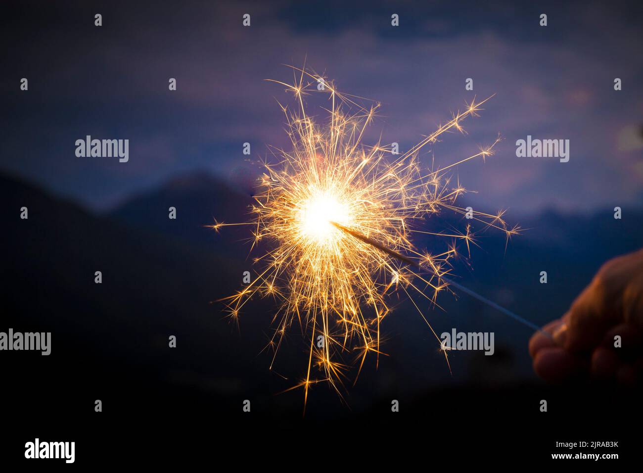 Hand holding firework stick hi-res stock photography and images - Alamy