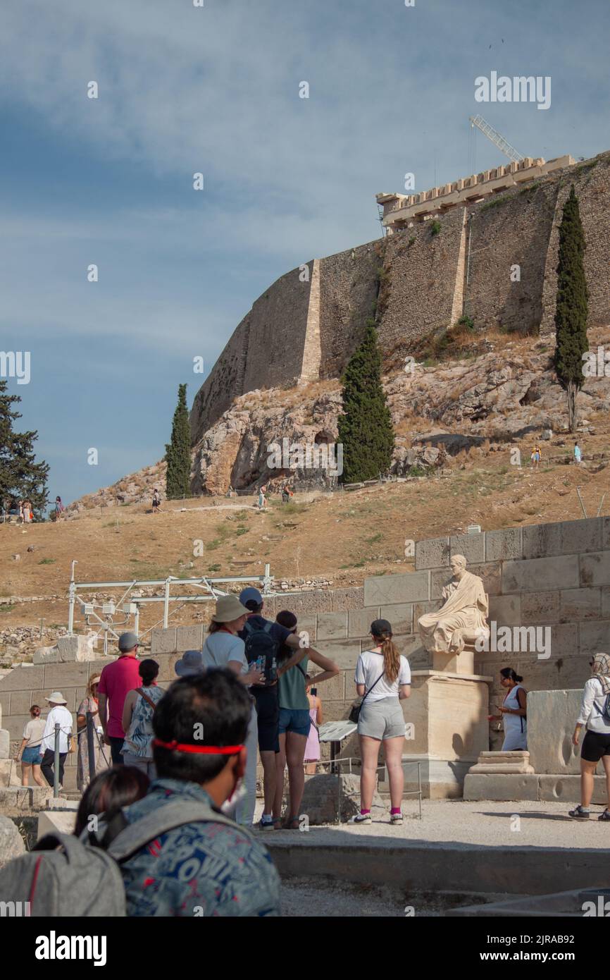 A vertical shot of people visiting the Theatre of Dionysus in Acropolis ...