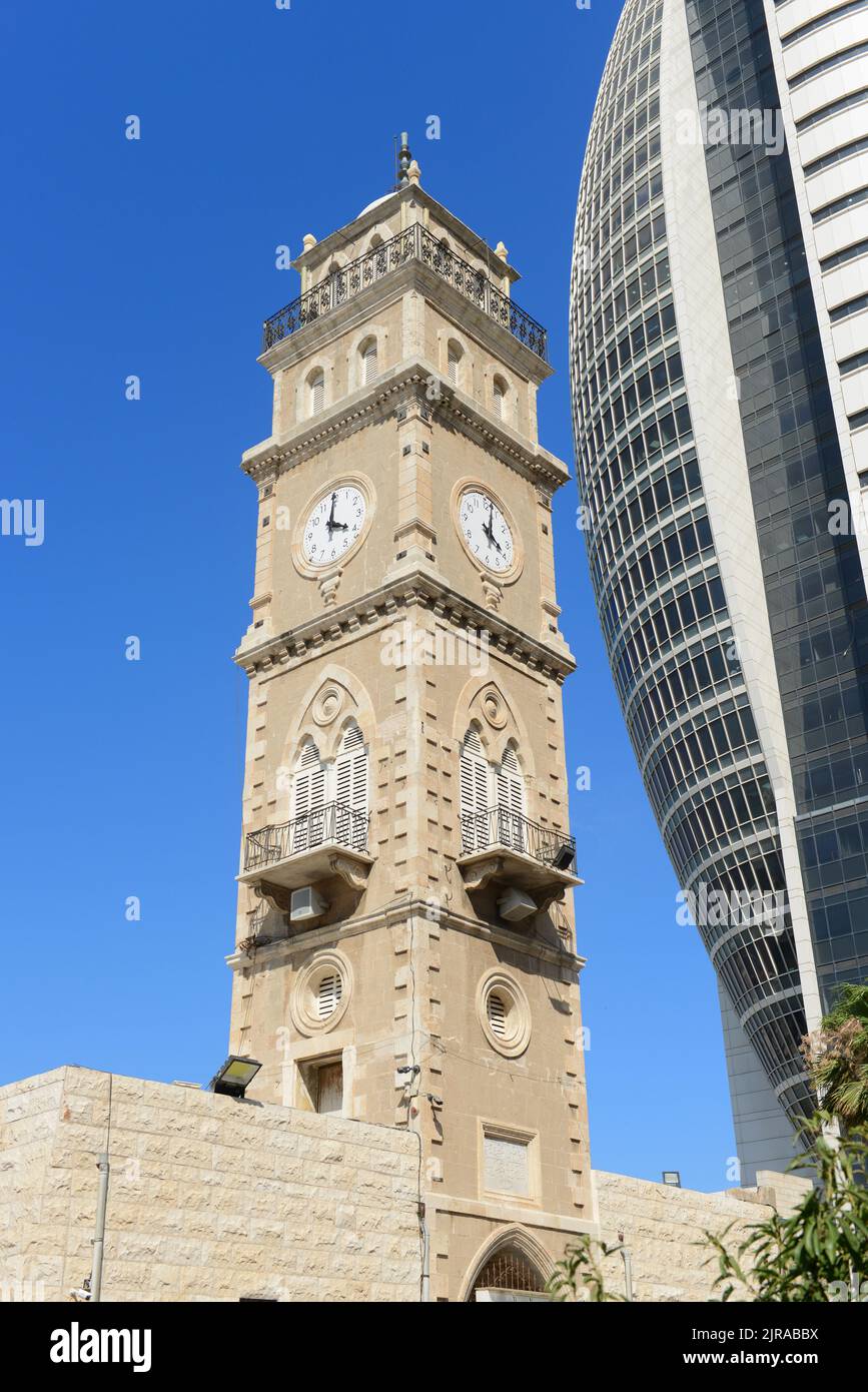 Al-Jarina Mosque with the Sail tower (Beit HaMifras ) building behind ...