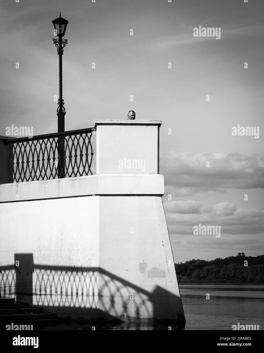 The vertical grayscale of a human's head visible from the building on ...