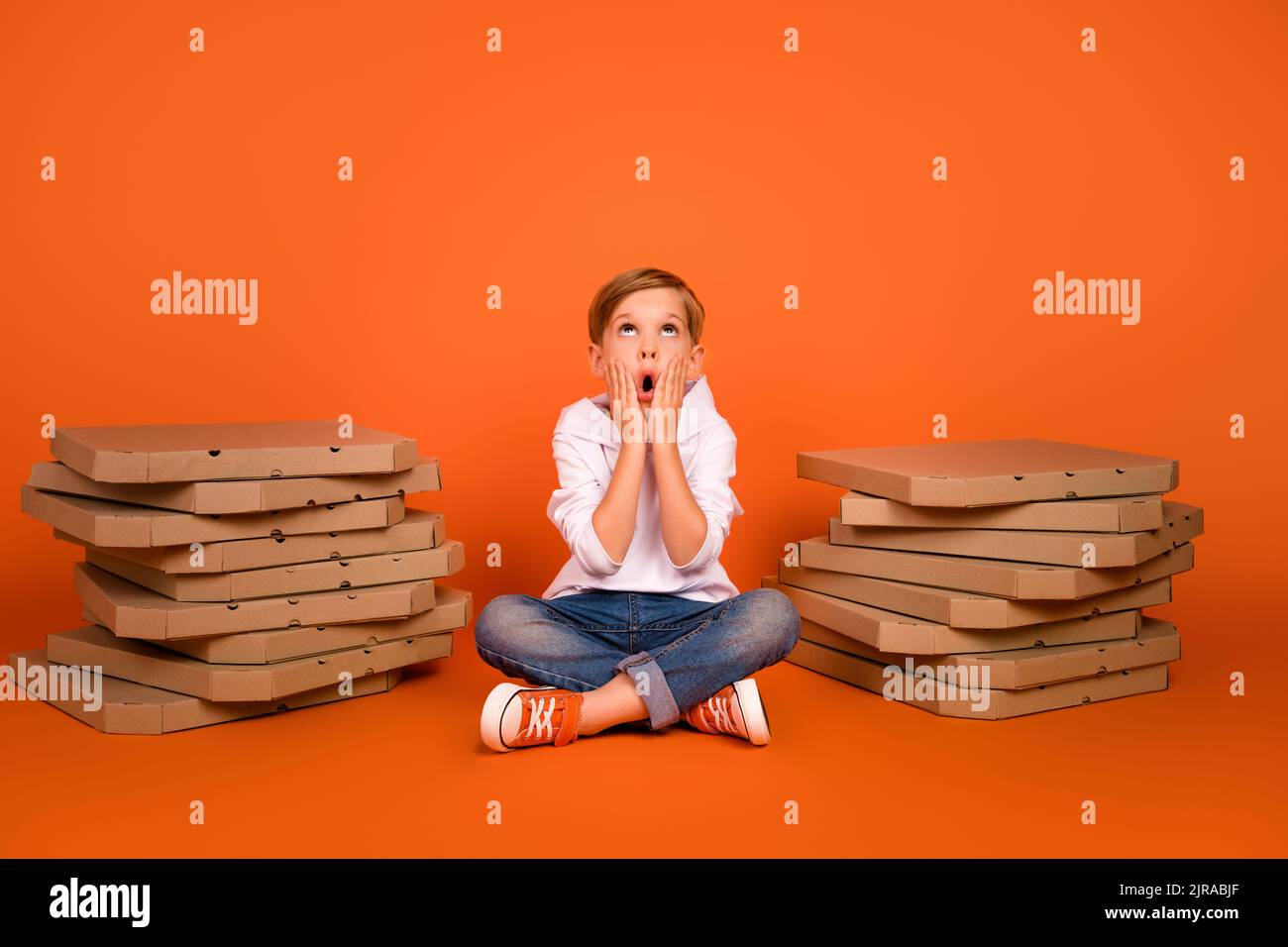 Full size photo of amazed kid sit floor look empty space pizzeria ...