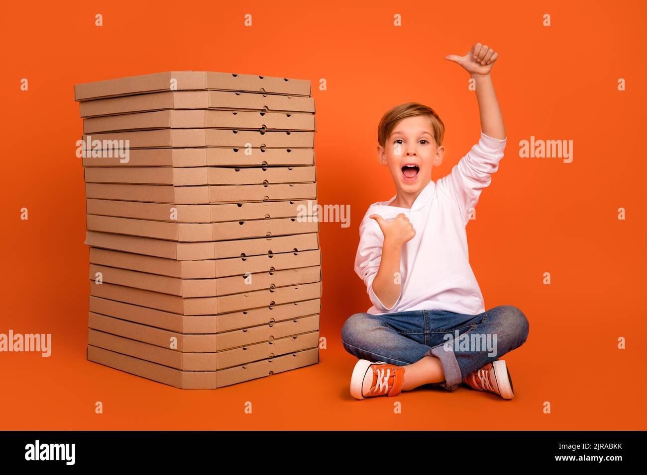 Full length photo of shock kid sit floor point finger box pie cafeteria ...