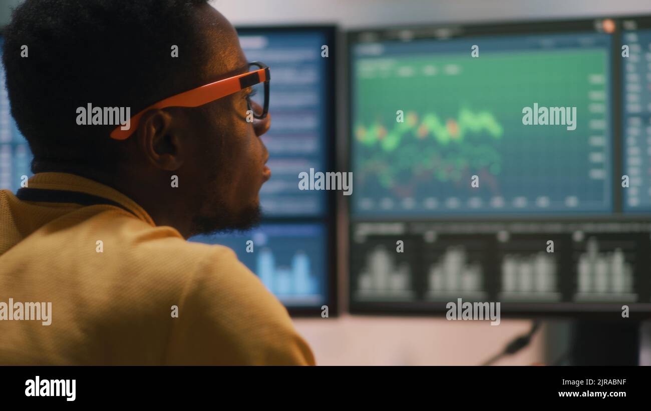 Male broker analyzing information on hi-res stock photography and ...