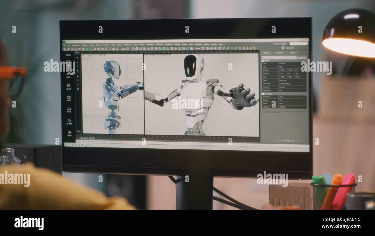 African American male creating 3D model of robot and rendering video ...