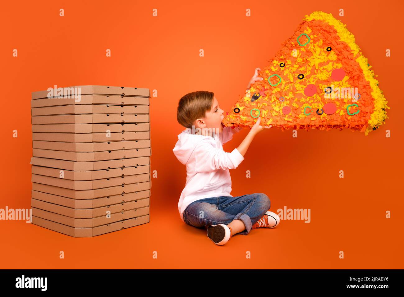 Full size photo of hungry kid boy eating big slice yummy pizza isolated ...