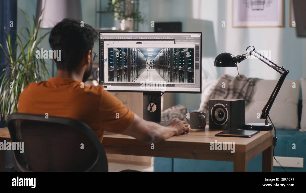 Indian male developer using computer to create and render 3D model of ...