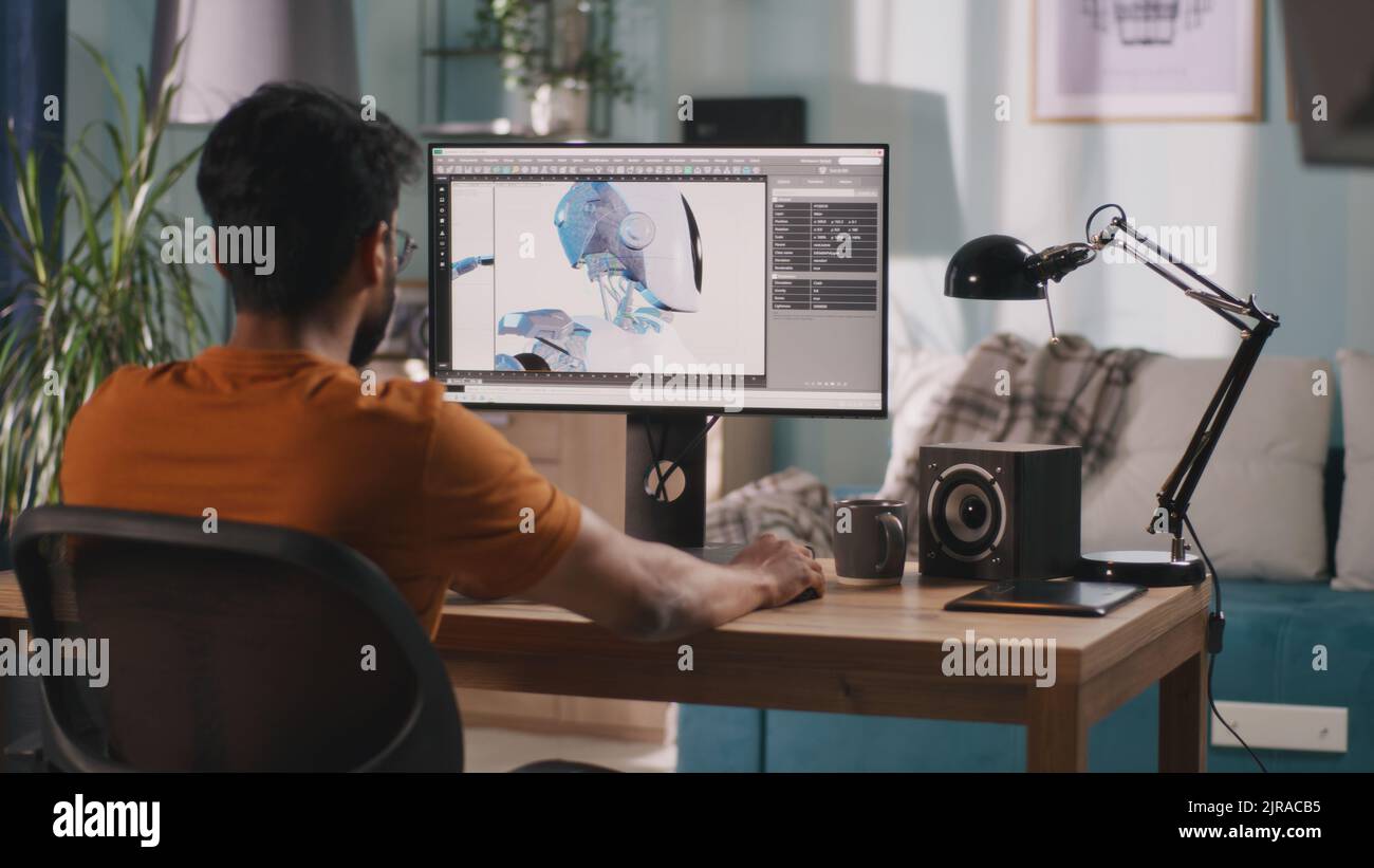 Indian male developer using computer to create and render 3D model of ...